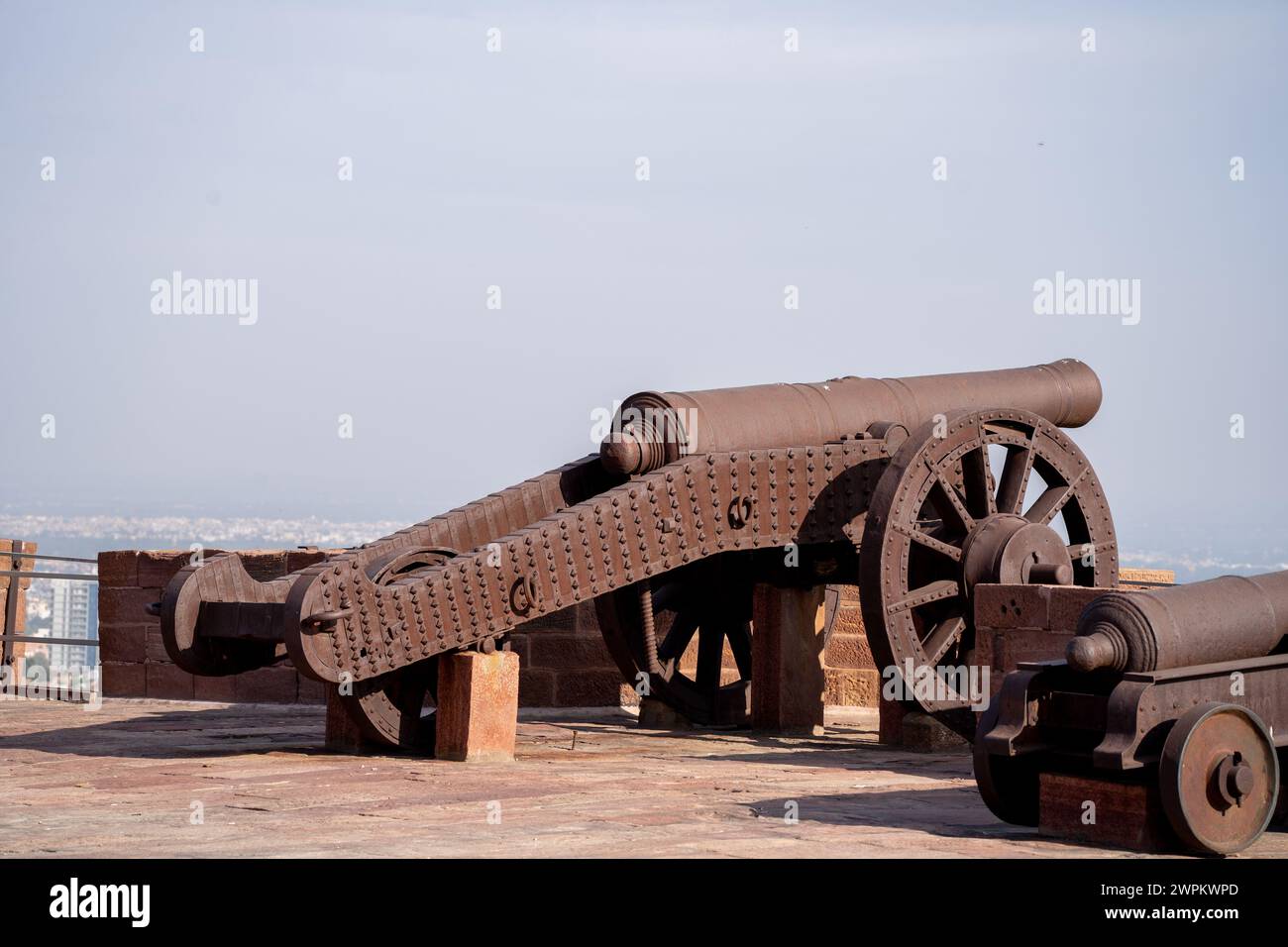 Massive iron cannon with wheels placed on the walls of mehrangarh amer ...