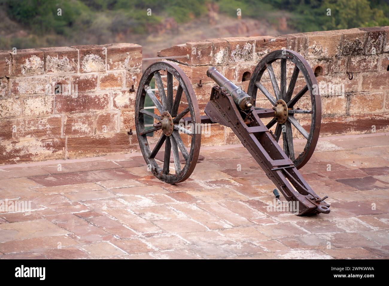 Small cannon with wheels placed along the walls of the rajput castle in ...