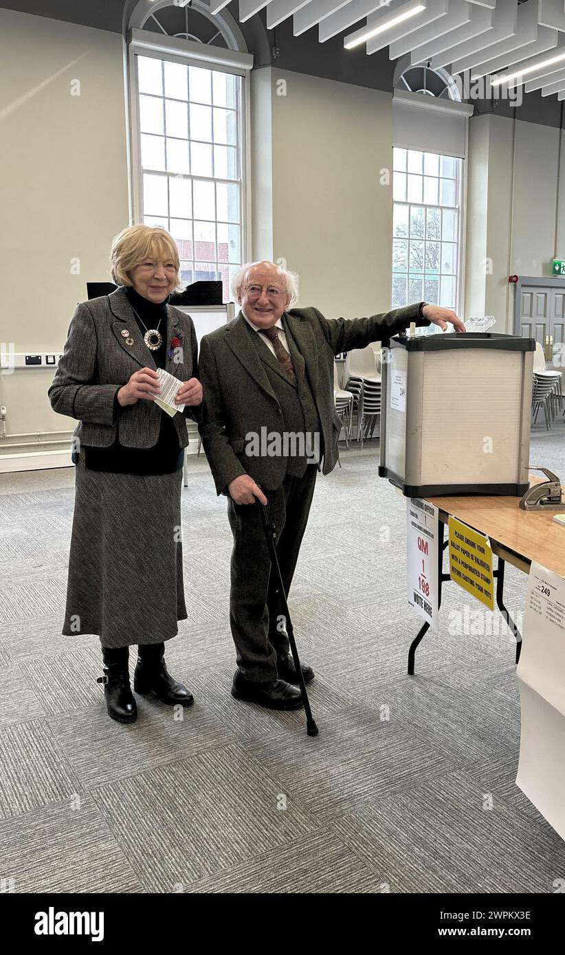 President of Ireland Michael D Higgins and his wife, Sabina, voting at ...