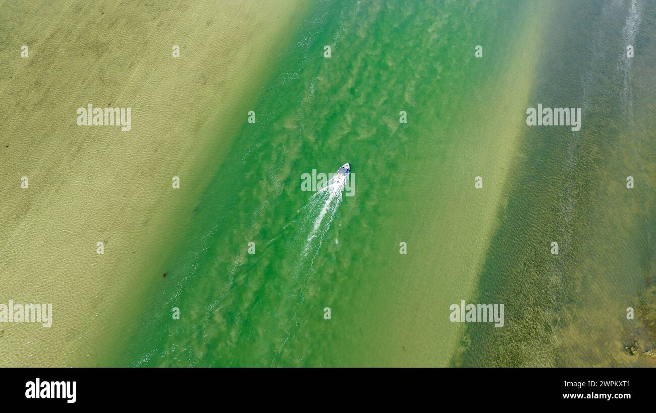 Boat in the turquoise waters of the Klein River Lagoon, Hermanus ...