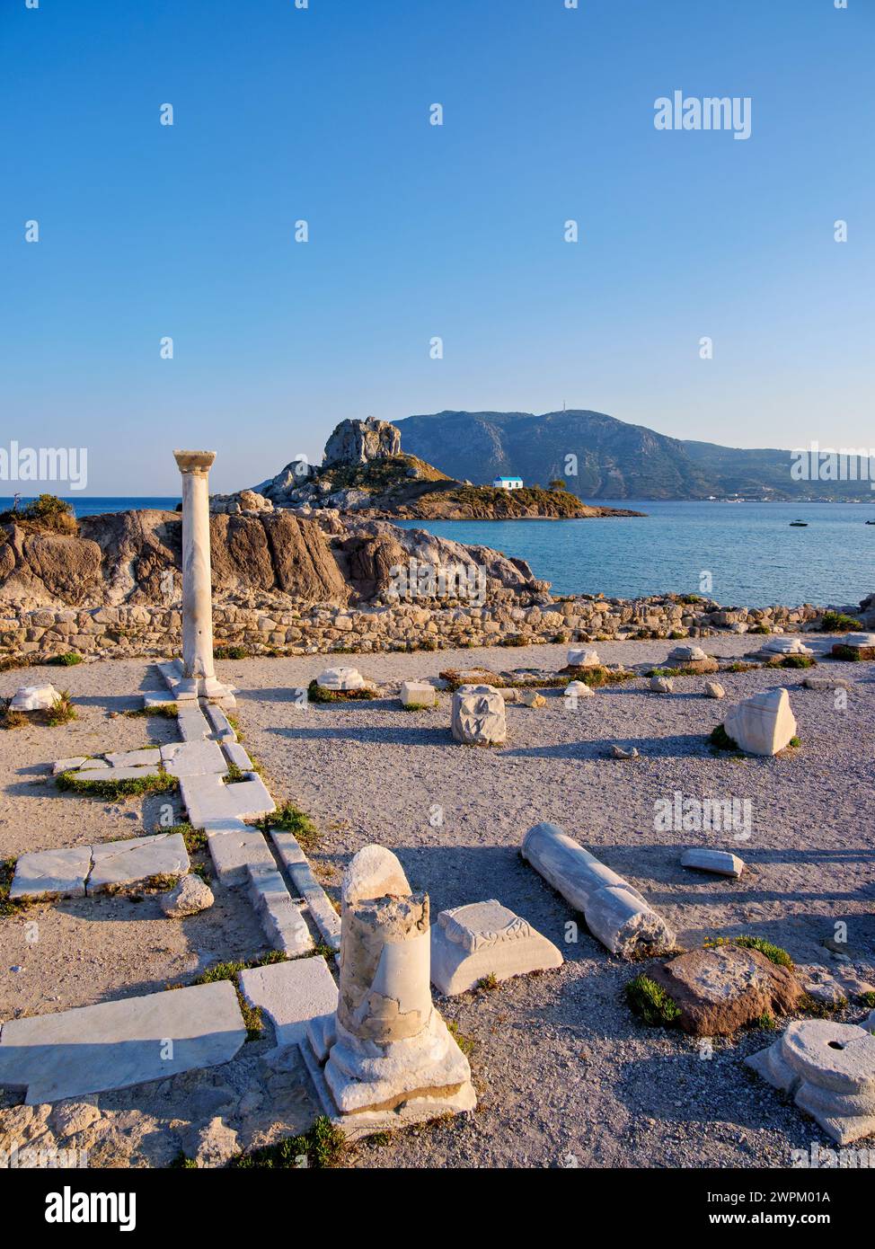 St. Stefanos Basilica Ruins and Kastri Island at sunset, Agios Stefanos ...