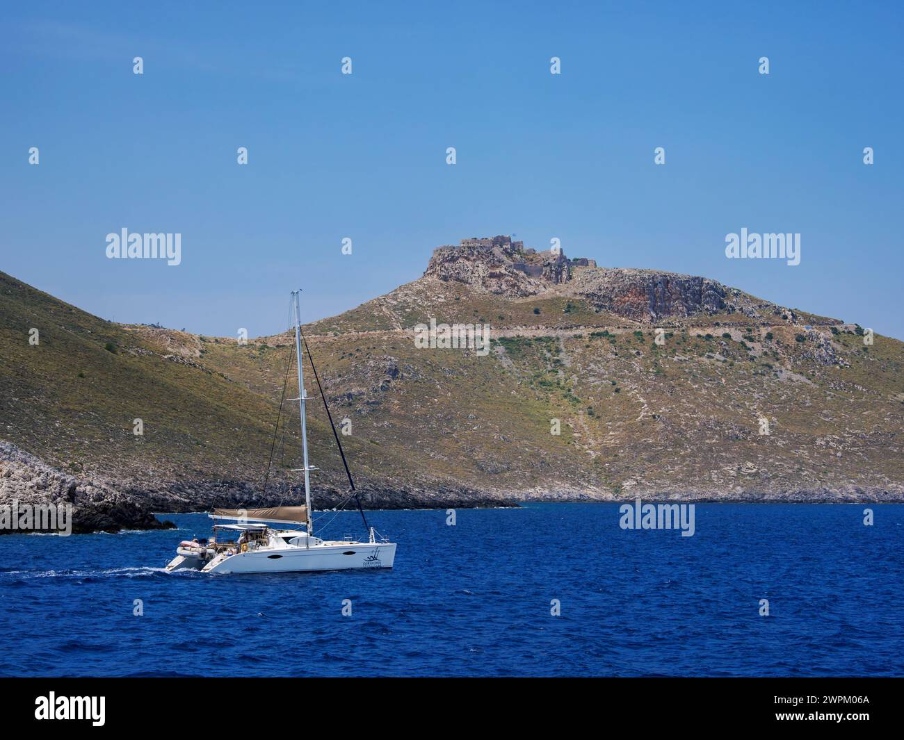 Sailboat off the coast and Medieval Castle of Pandeli, Leros Island ...