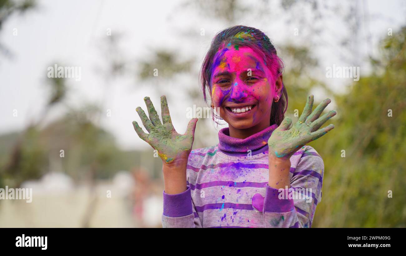 Children covered in colored powder during the festival of Holi. Happy ...