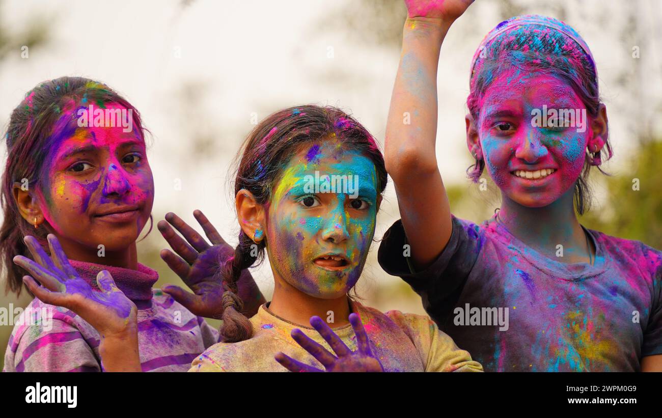 Happy Cute Smiling looking kids playing with paints in their fingers ...