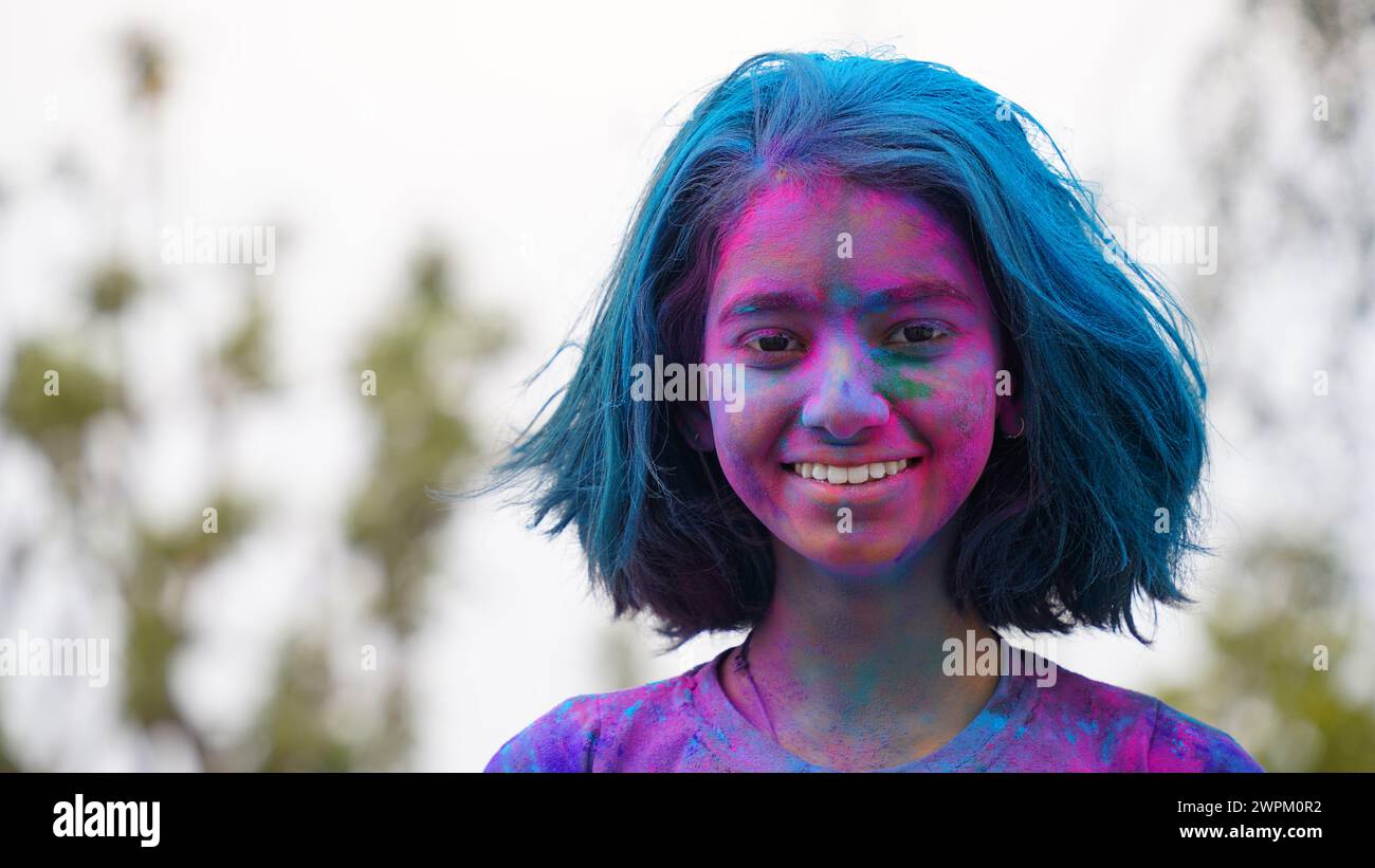 Young cute cheerful little kids with applied holi colors powder showing ...