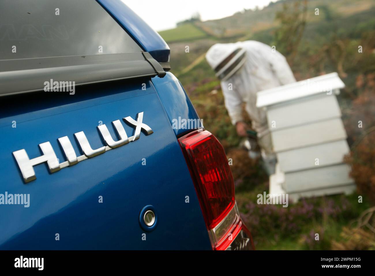 11/09/15 A bee farmer uses his new Toyota Hilux to attend to his ...