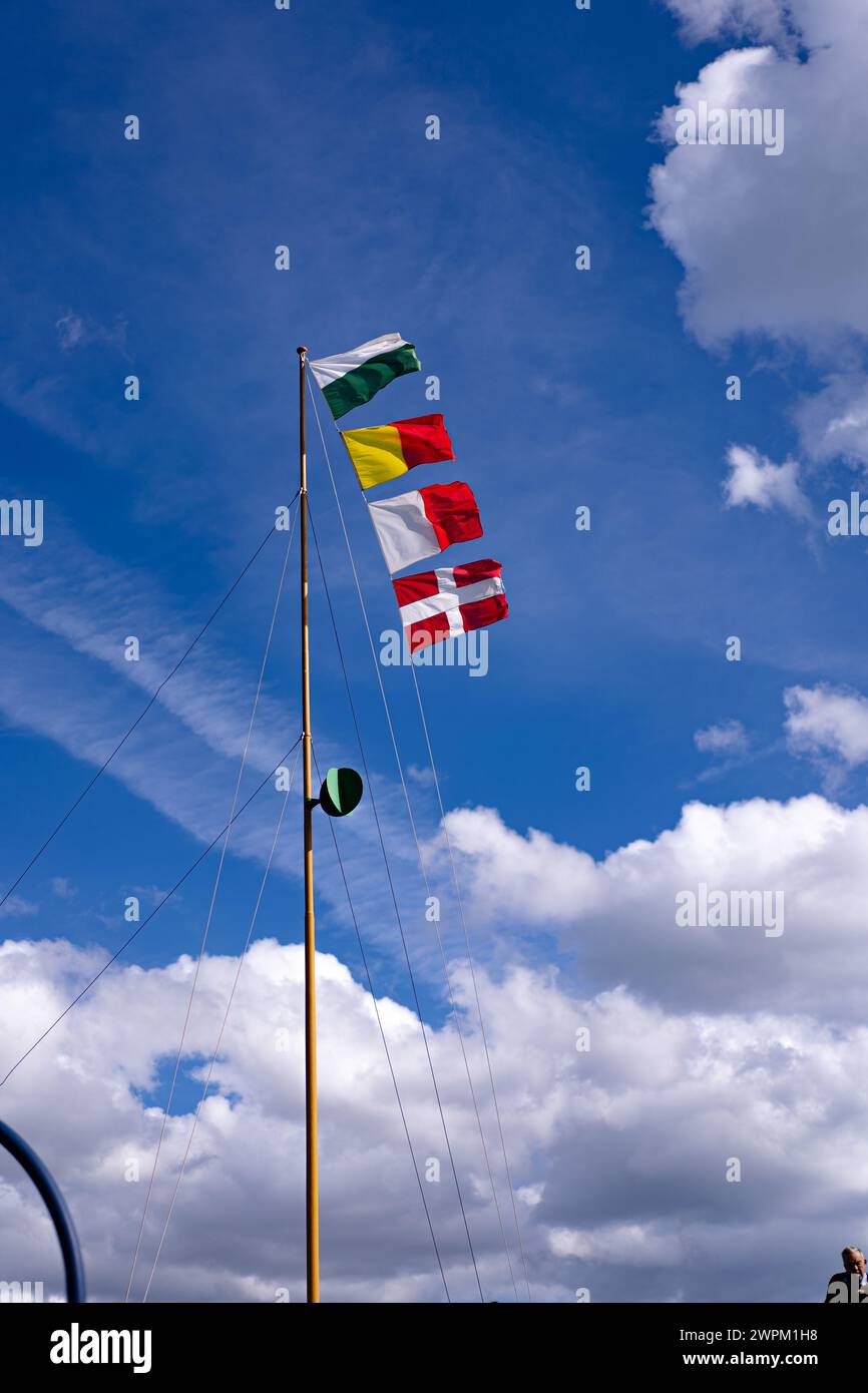 Numerous flags flying on mast for various purposes like signaling Stock ...