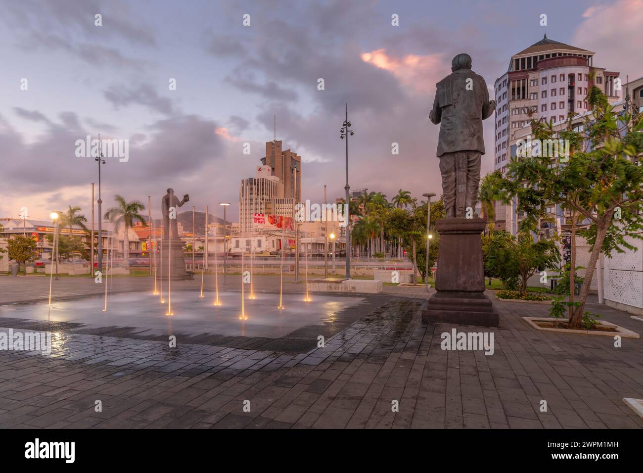 View of statue in Caudan Waterfront in Port Louis at dusk, Port Louis ...