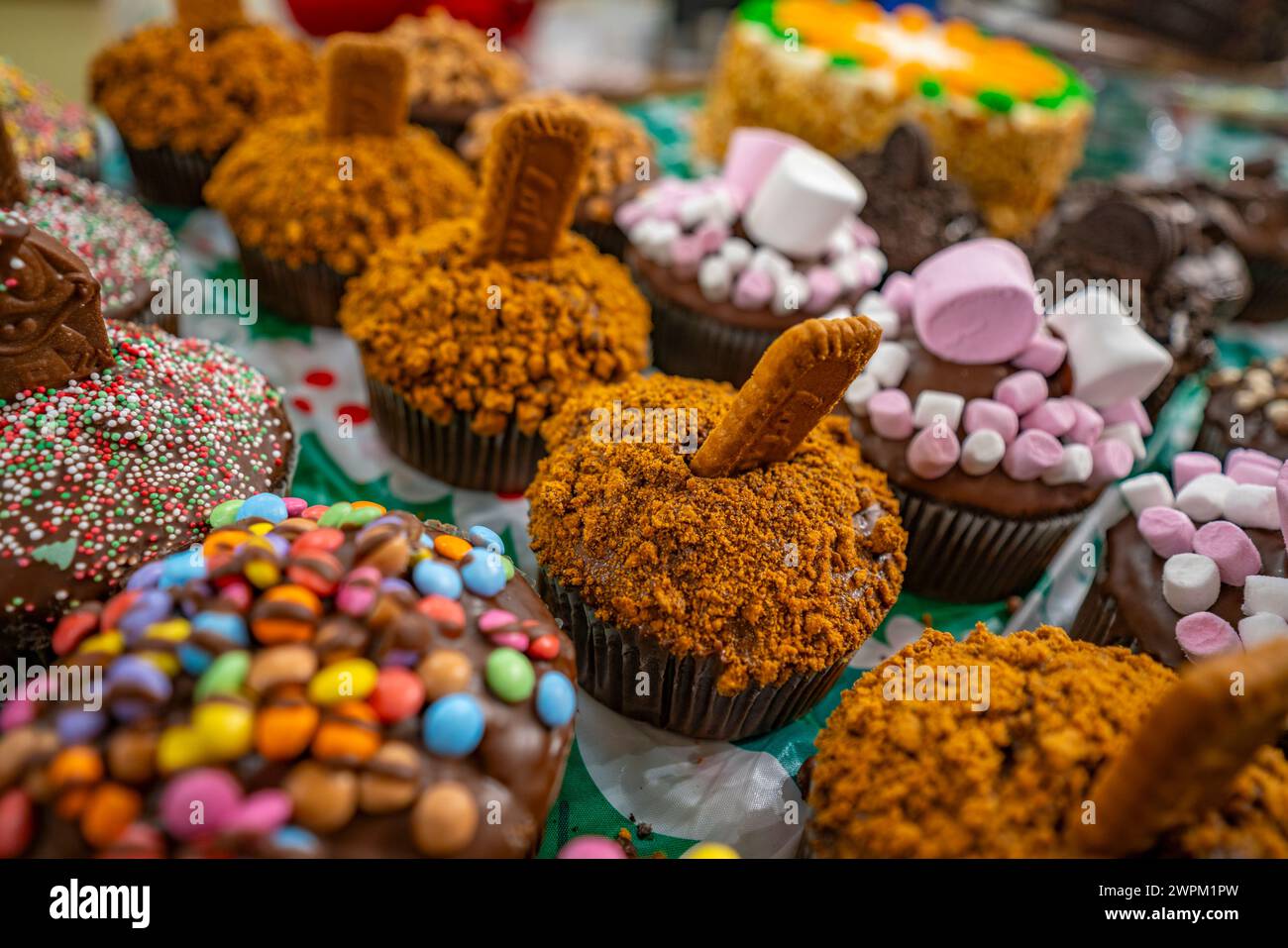 Cakes on Christmas Market stall in Old Market Square at dusk ...