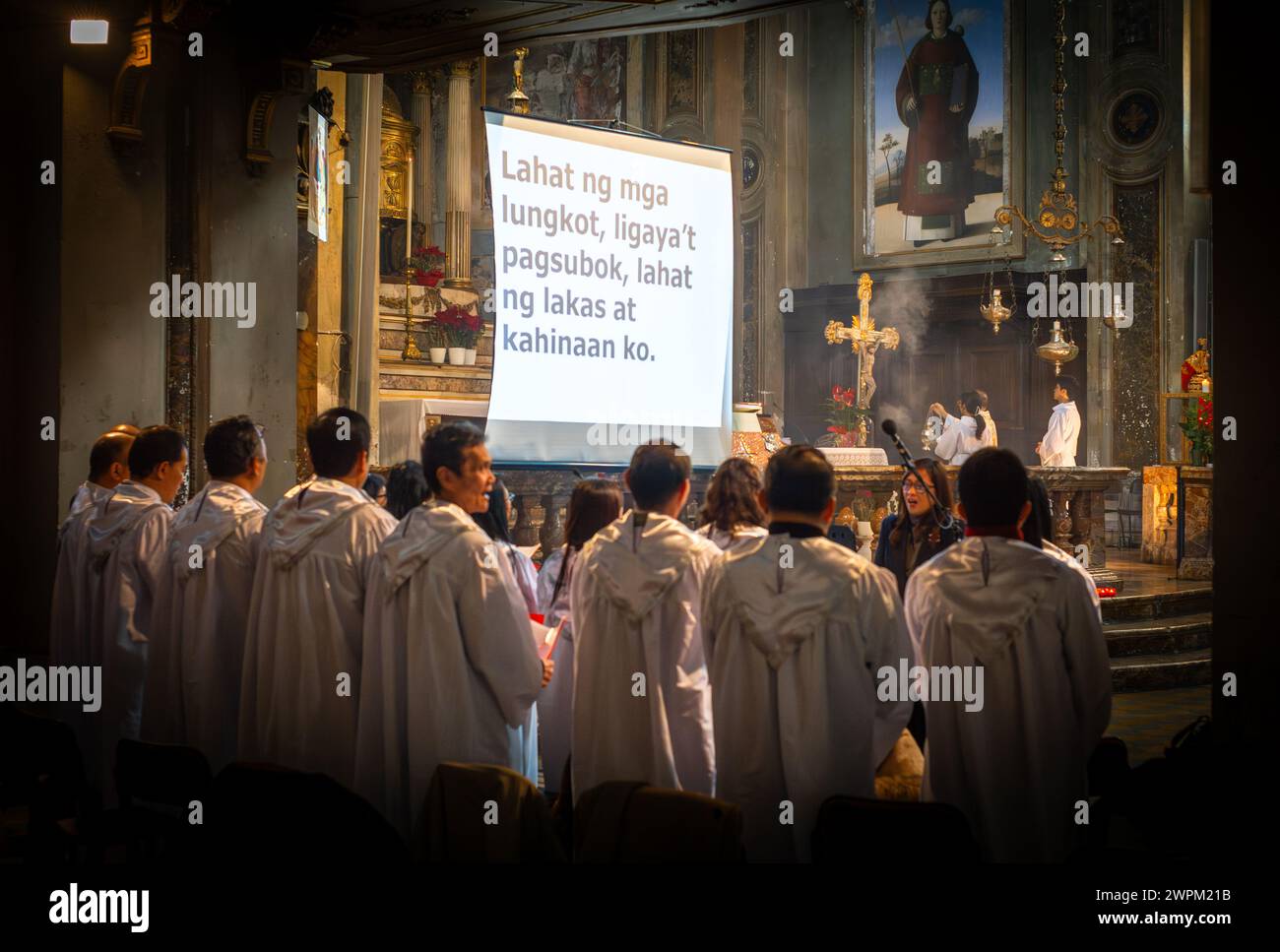 A Filipino choir sings in Tagalog at a catholic mass in St Stefano ...