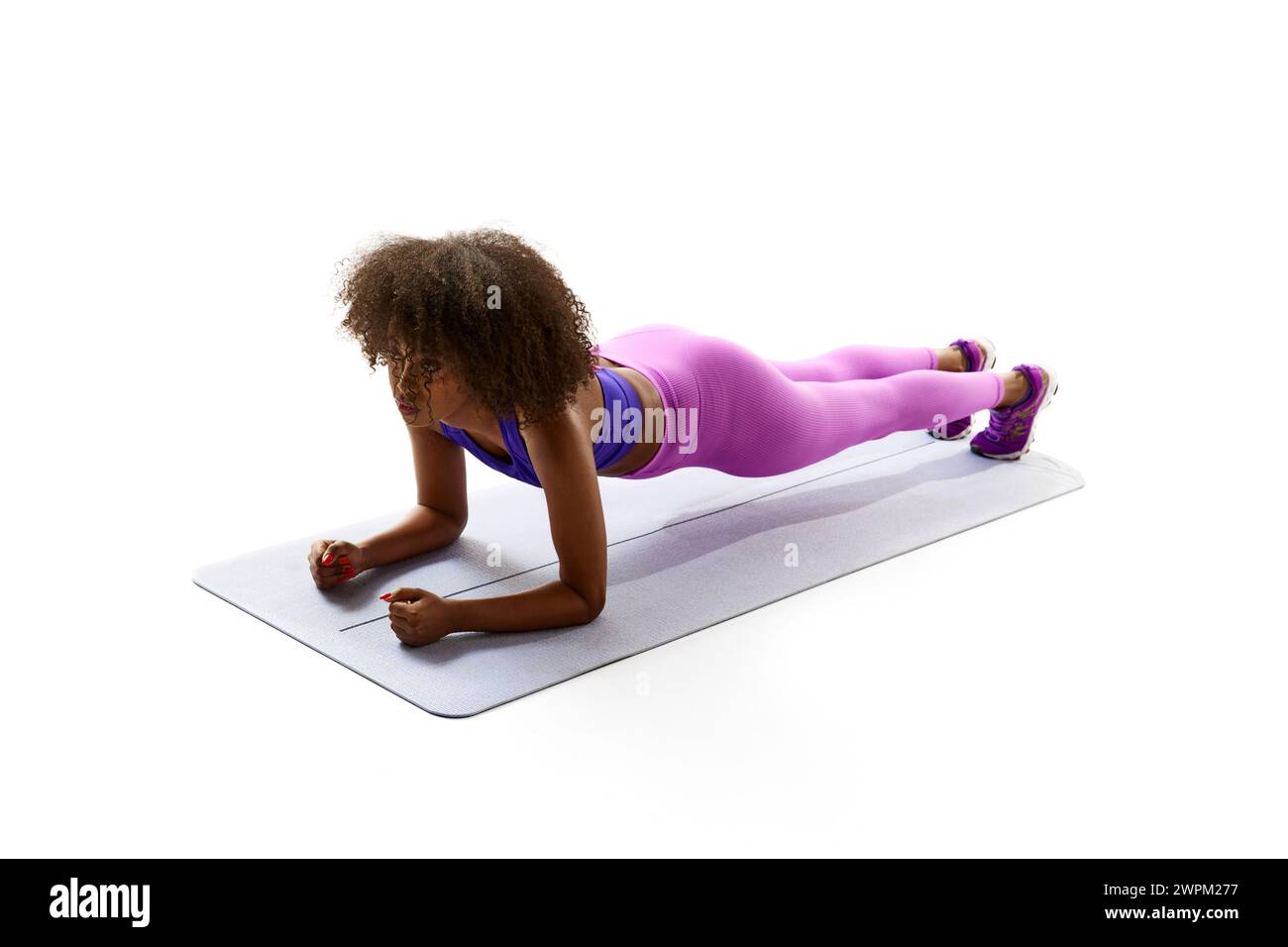 Strength and power. Young, focused African-American woman stands in ...