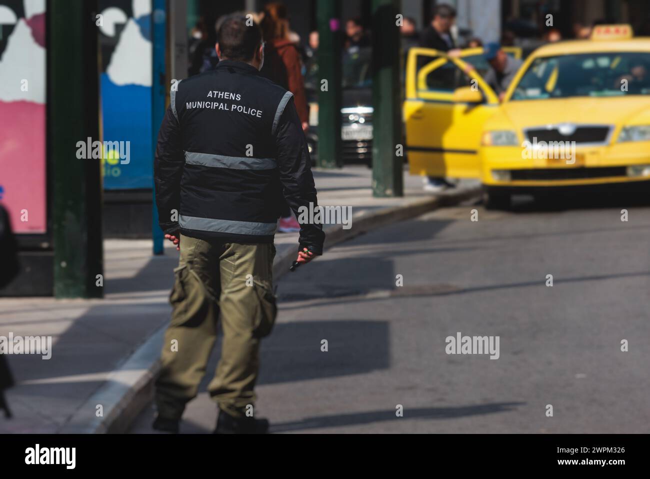 Athens Municipal Police with "Municipal Police" logo emblem on uniform ...