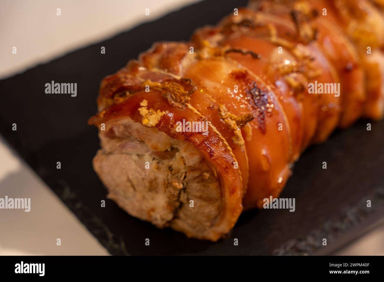 Baked pork wrapped in a roll. Pork roll close-up Stock Photo - Alamy