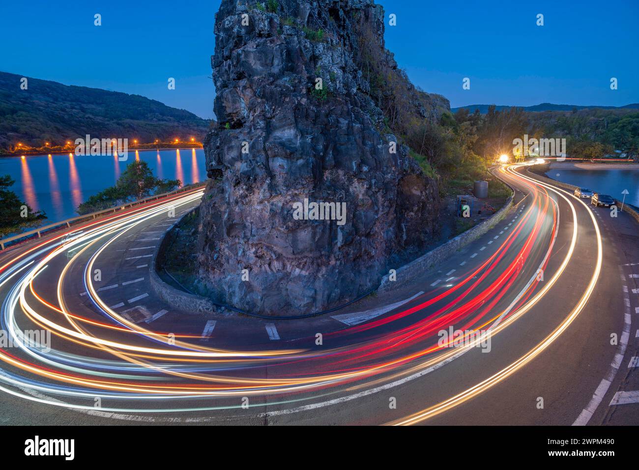 View of trail lights at Baie du Cap from Maconde Viewpoint at dusk ...