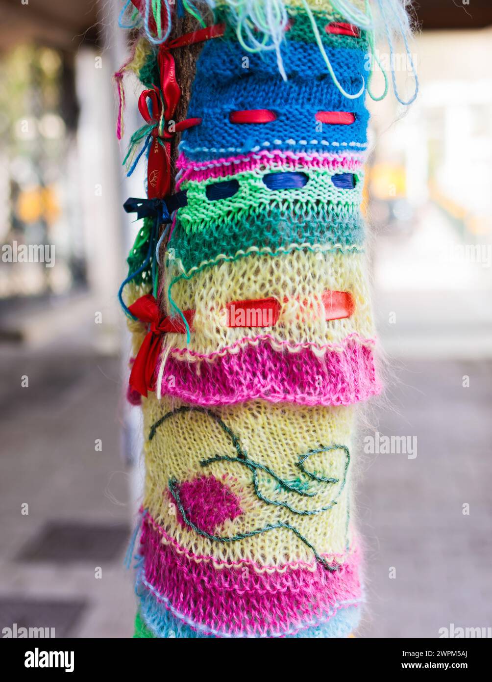 Yarnbombing, trees decorated with yarn bombing, knitted graffiti street ...