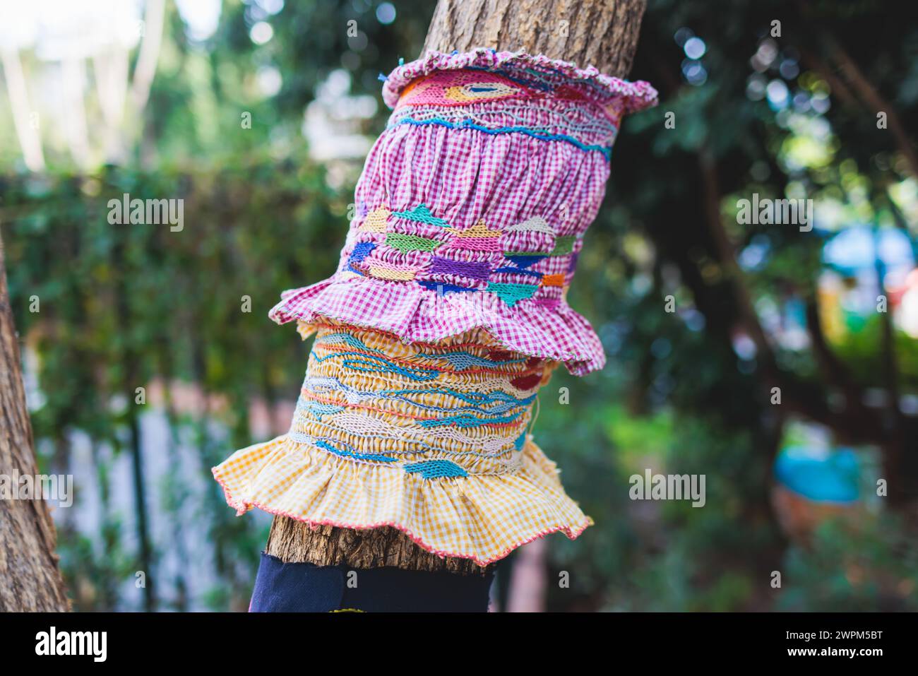 Yarnbombing, trees decorated with yarn bombing, knitted graffiti street ...