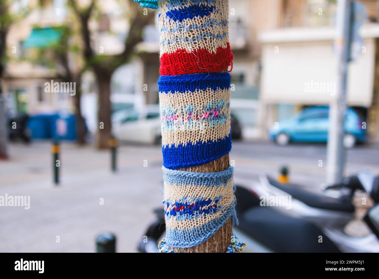 Yarnbombing, trees decorated with yarn bombing, knitted graffiti street ...