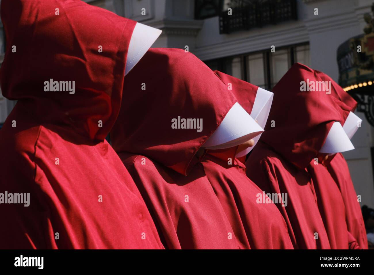 London, UK. 8th Mar 2024. Iranian women wearing the Handmaid's Tale red ...