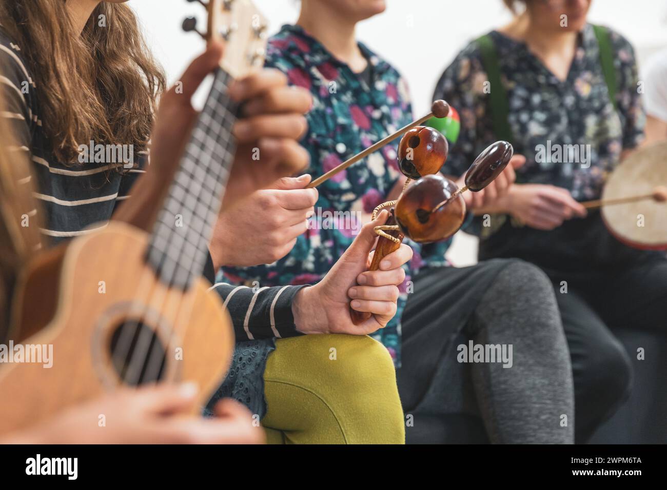 Music therapy concept, a group of people playing different types of ...