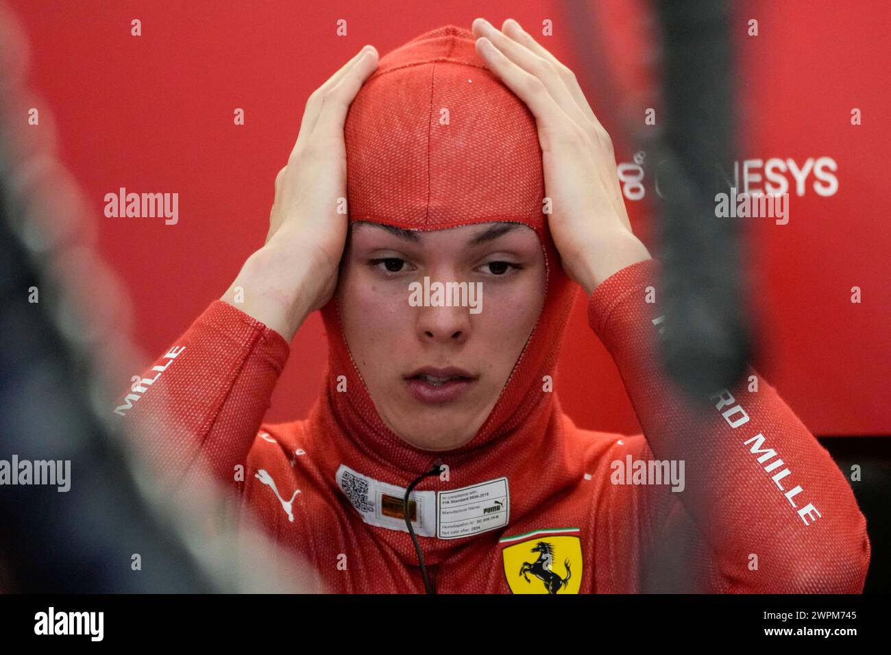 British Ferrari driver Oliver Bearman wears the balaclava at pits prior ...
