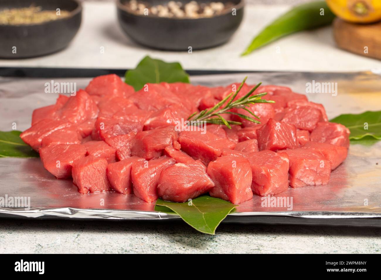 Beef cubed meat. Butcher products. Chopped raw beef on stone background ...
