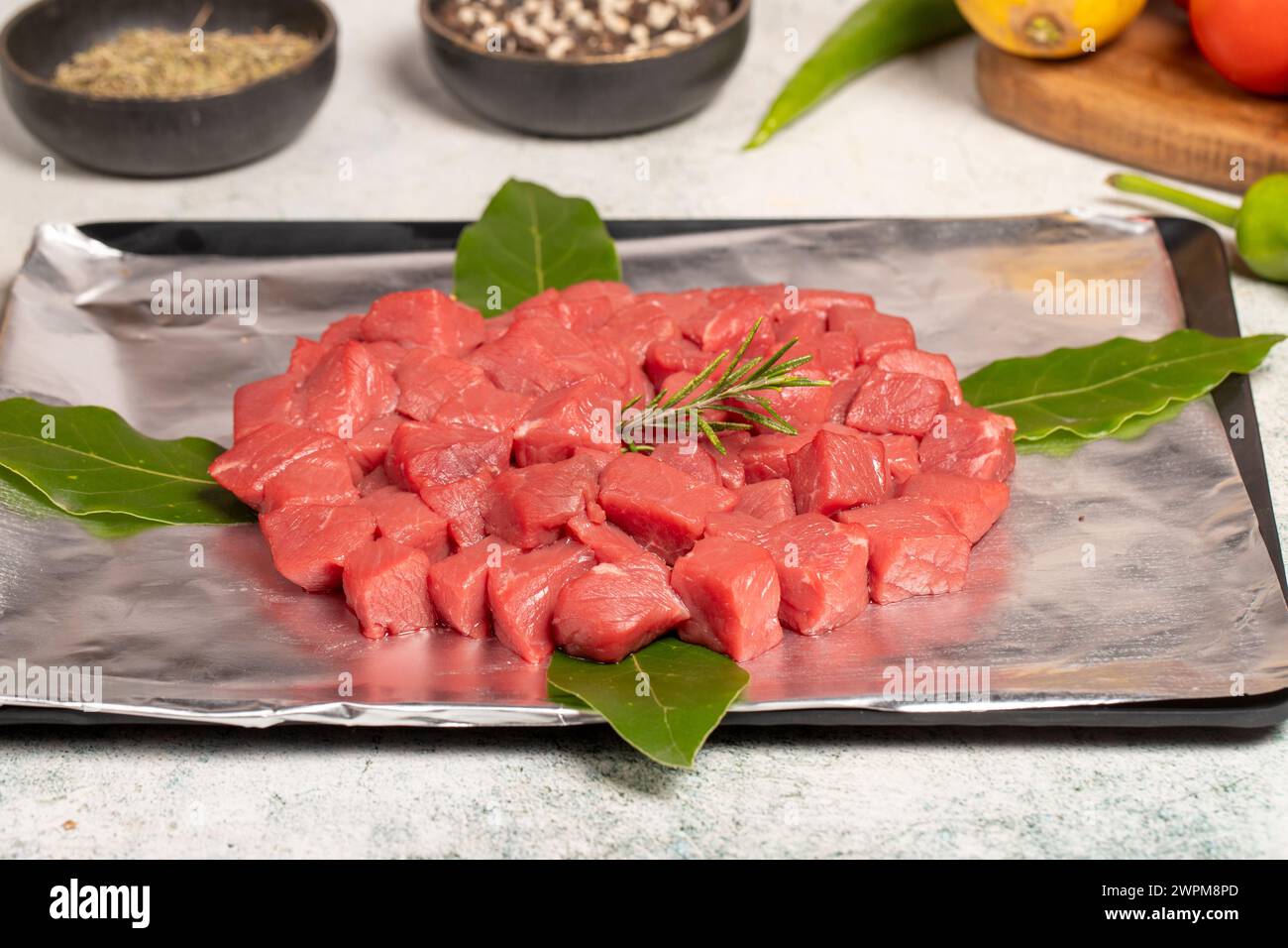 Beef cubed meat. Butcher products. Chopped raw beef on stone background ...