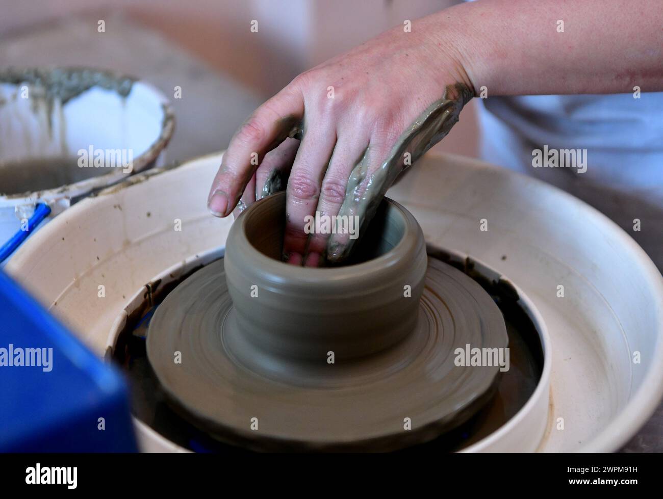 Damascus, Syria. 18th Jan, 2024. Rama Saman crafts a vase out of clay ...