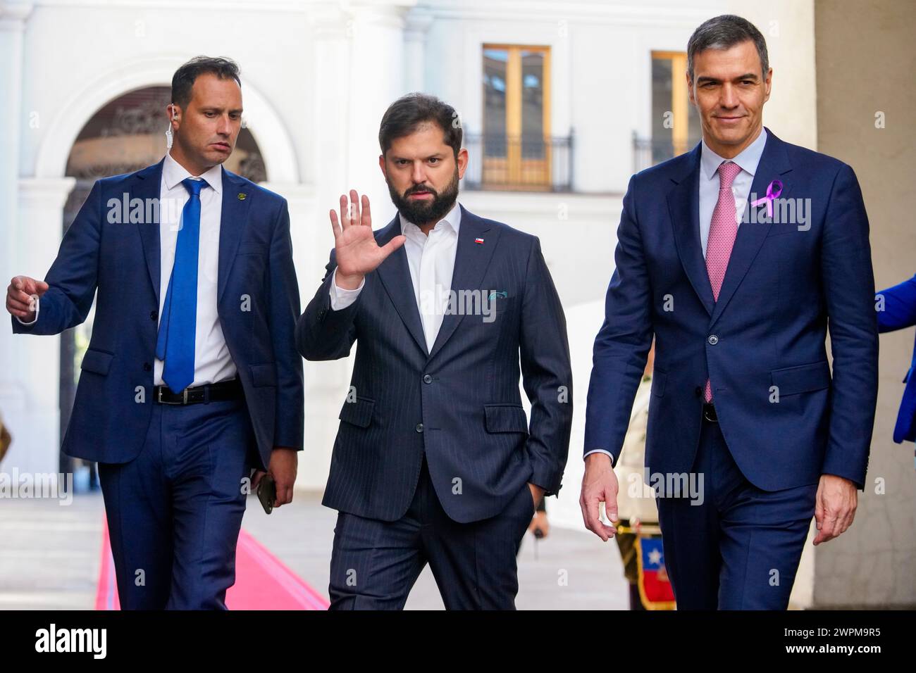 Chilean President Gabriel Boric, center, walks with Spain's Prime ...
