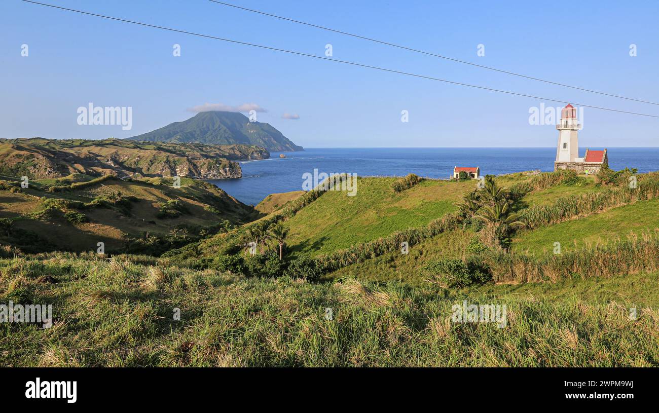 Batan, Philippines. Mar 8, 2024: Tayid lighthouse. Batanes cliffs are ...