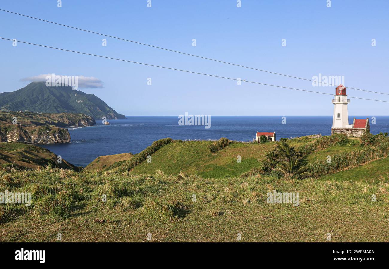 Batan, Philippines. Mar 8, 2024: Tayid lighthouse. Batanes cliffs are ...