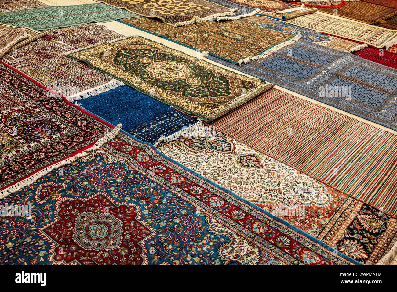 assortment of traditional hand woven Indian carpets and rugs (also ...