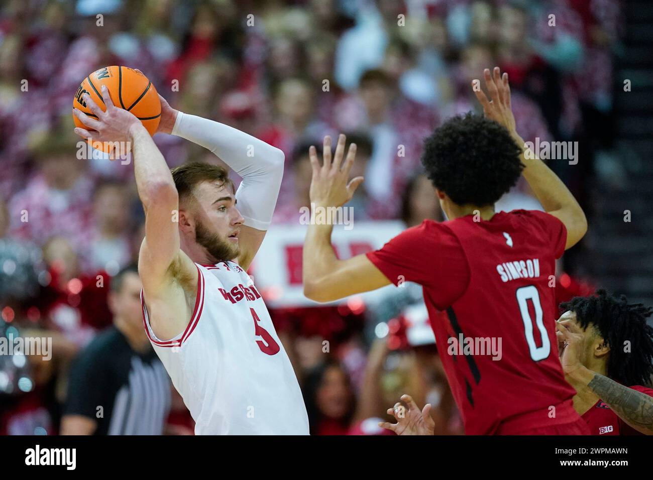 Wisconsin's Tyler Wahl (5) against Rutgers' Derek Simpson (0) during ...