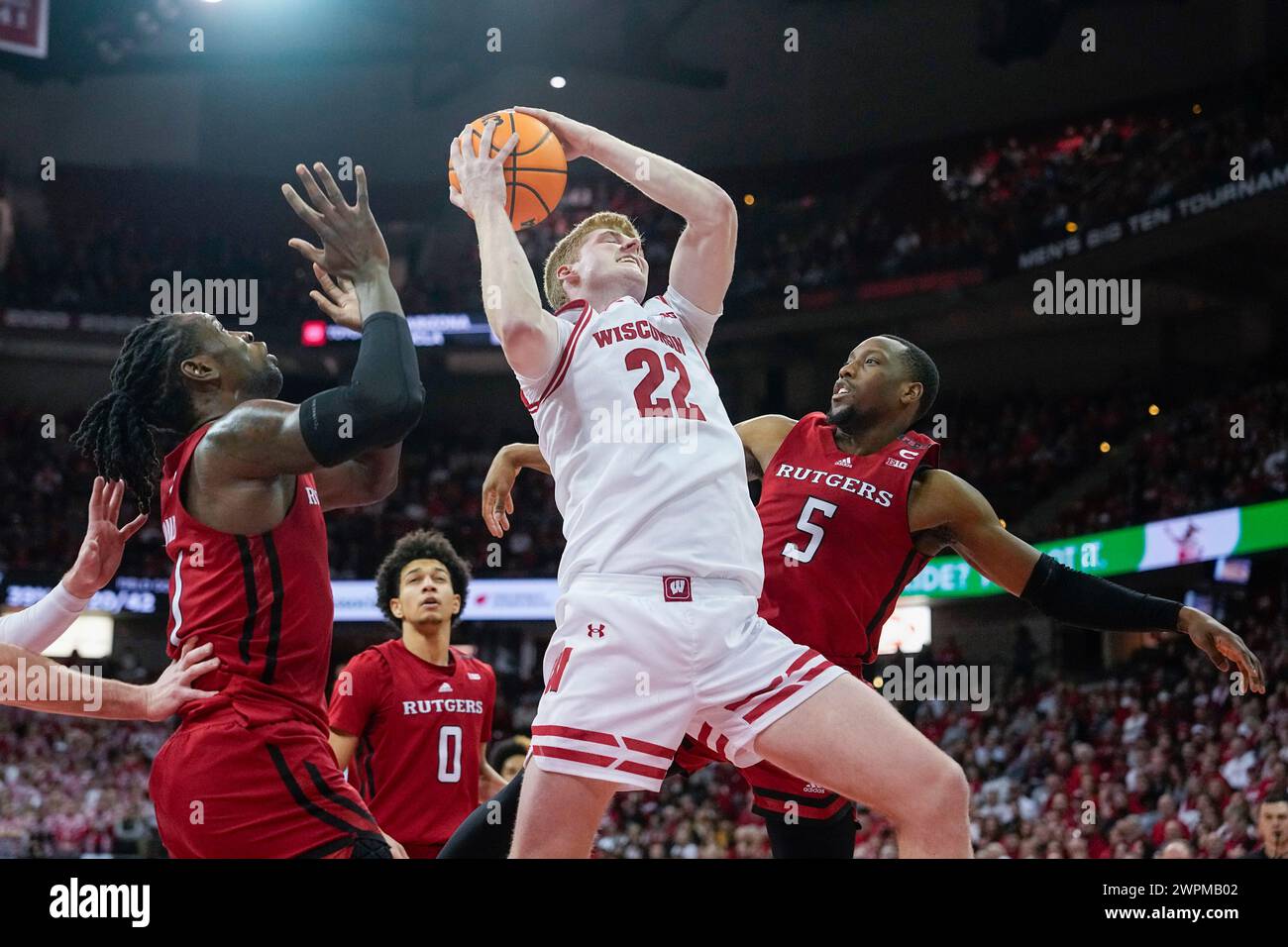 Wisconsin's Steven Crowl (22) against Rutgers' Clifford Omoruyi, left ...