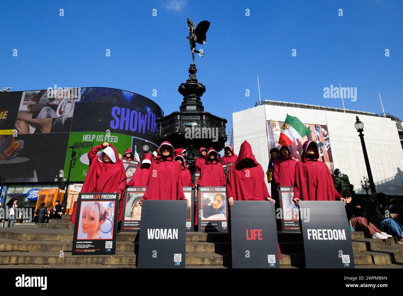 Iranian women wearing the Handmaid's Tale red robes march for ...