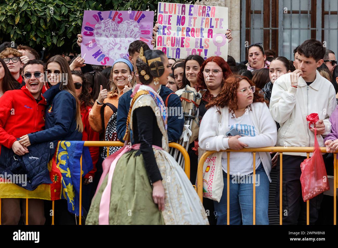 A fallera waves during a 'mascletà' of the Fallas 2024, on March 8 ...