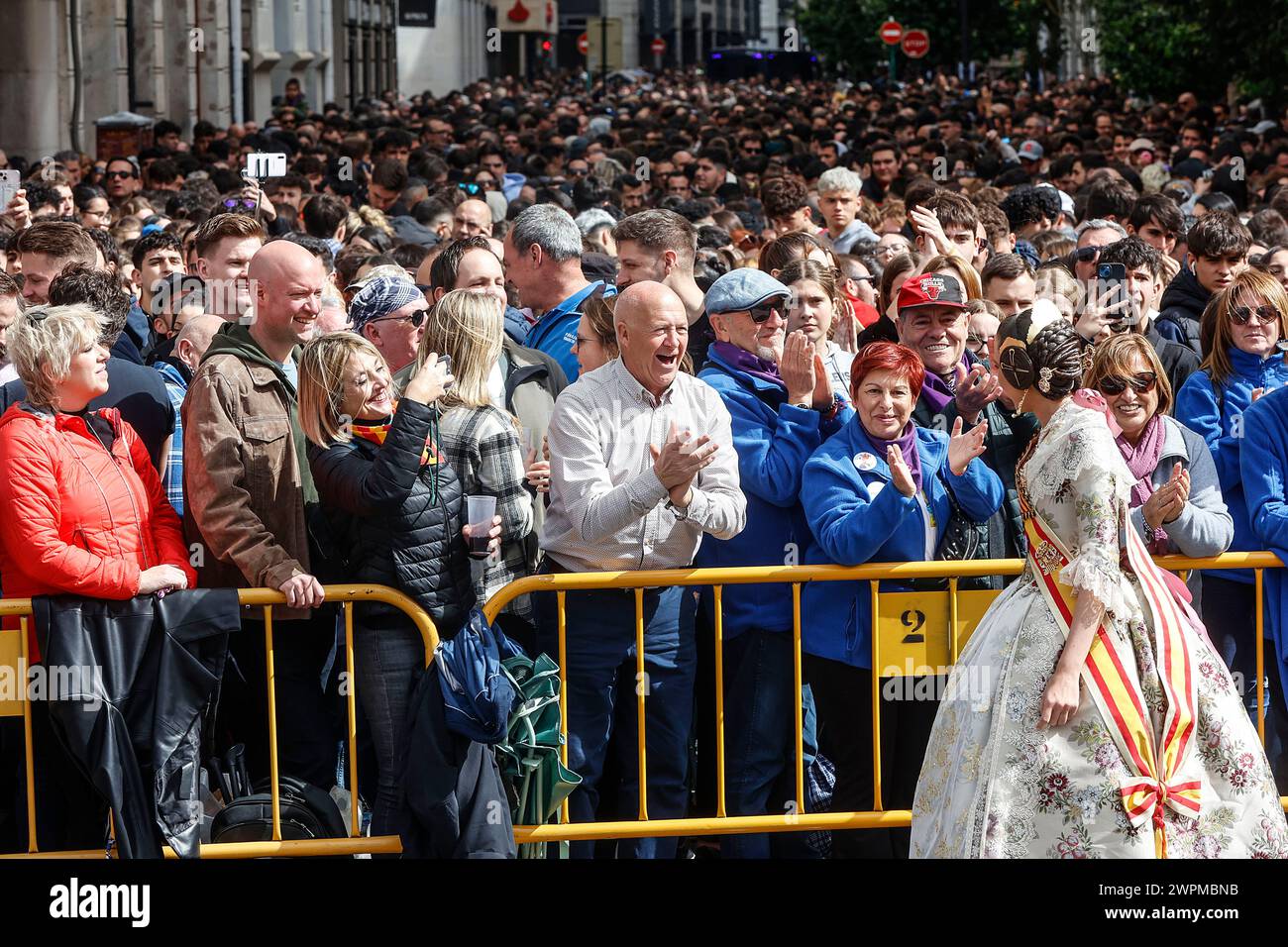 A fallera waves during a 'mascletà' of the Fallas 2024, on March 8 ...