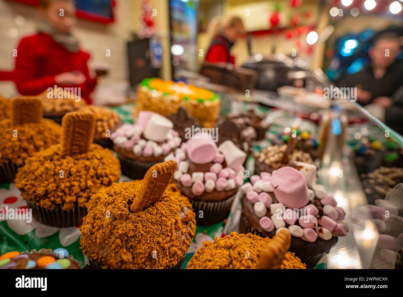 Cakes on Christmas Market stall in Old Market Square at dusk ...
