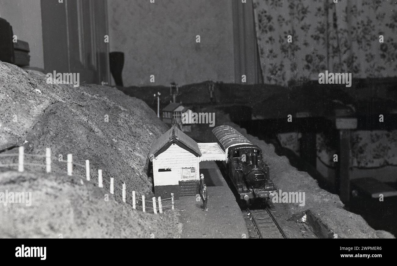 1950s, historical, inside room of house, a model railway, picture shows ...