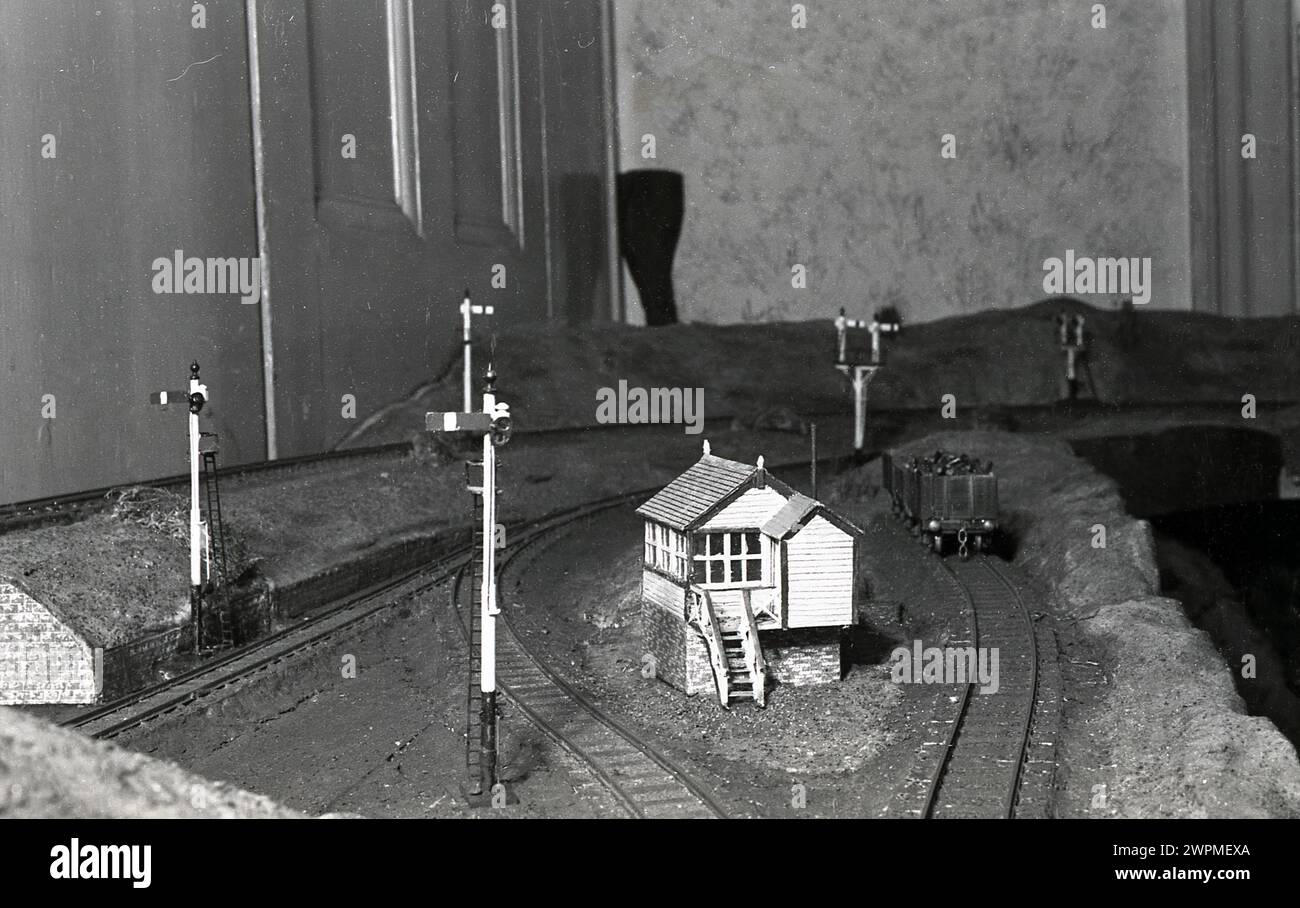 1950s, historical, inside room of house, a model railway, picture shows ...