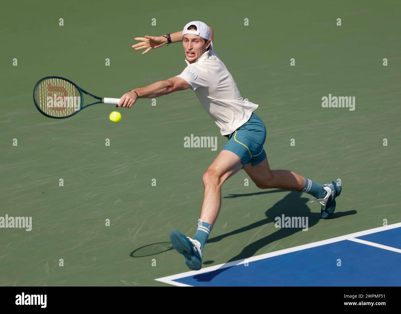 Professional sportsperson sport competition action stadium mid air holding hi-res stock ...