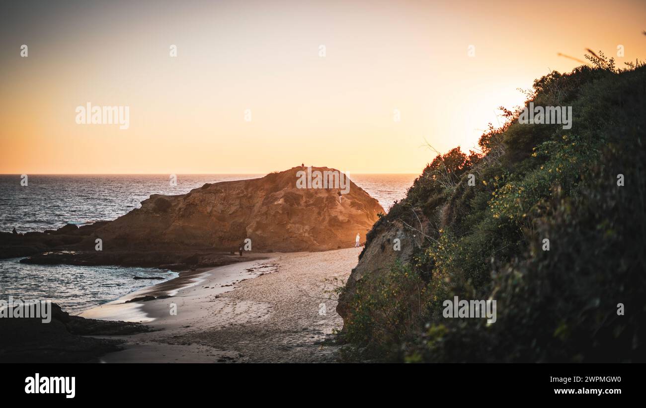 Tranquil sunset ocean cliff landscape hi-res stock photography and ...