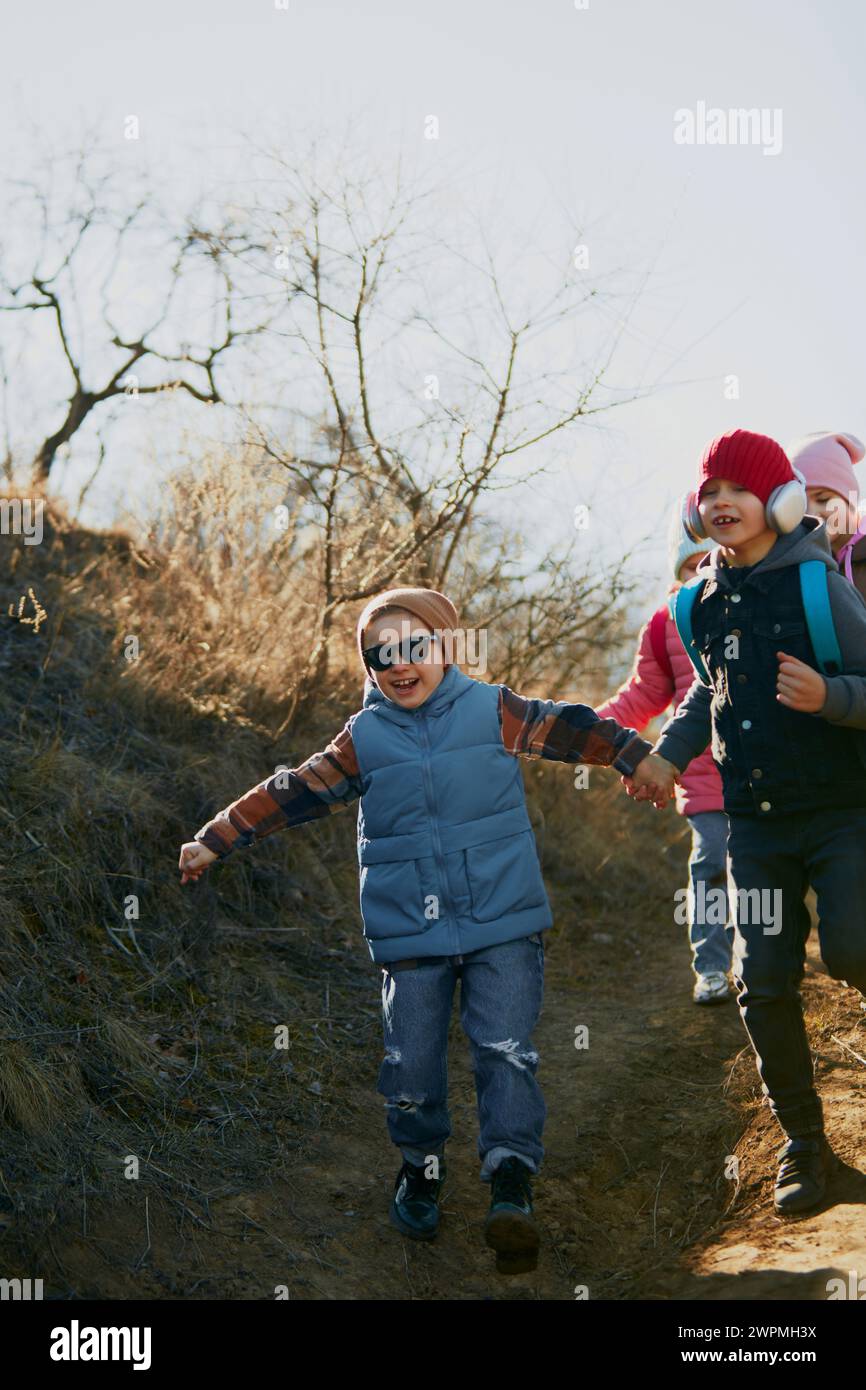 Group of kids, pre-schoolers, boys and girls, with colorful hats and ...