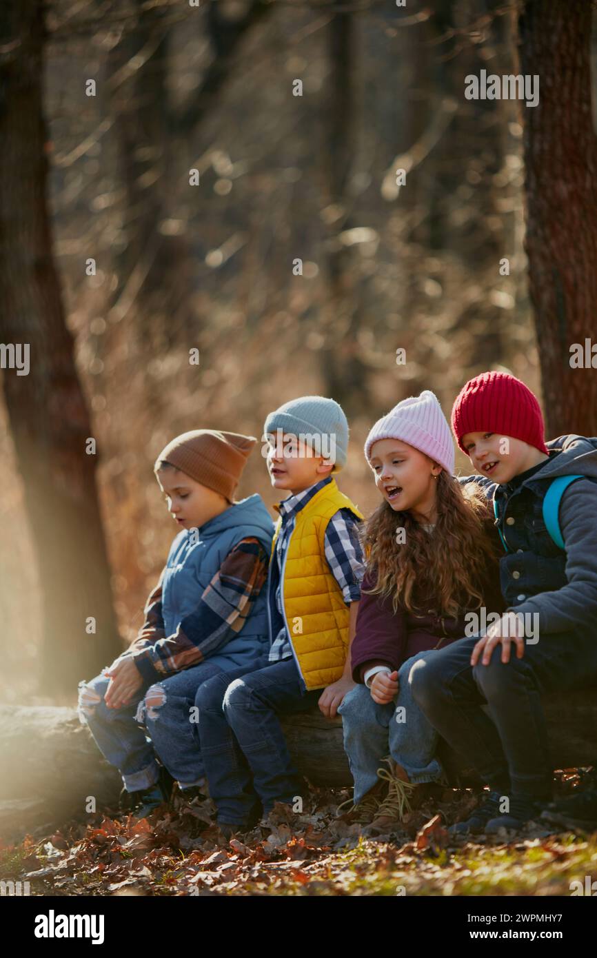 Group of children, boys and girls with various hats sitting together on ...