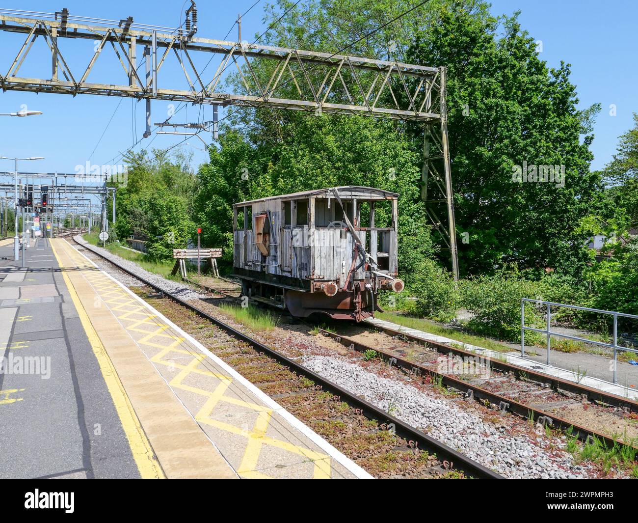 Derelict timber train wagon at Sheffield railway station, Essex. C2C ...