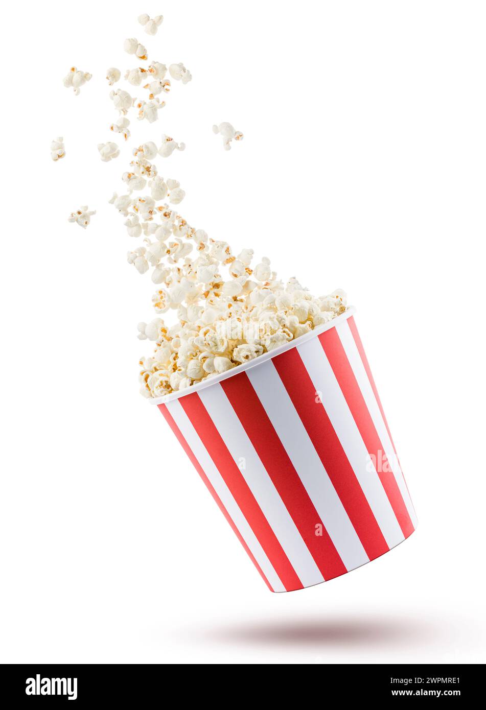 Popcorn flying from red and white striped container, isolated on white ...