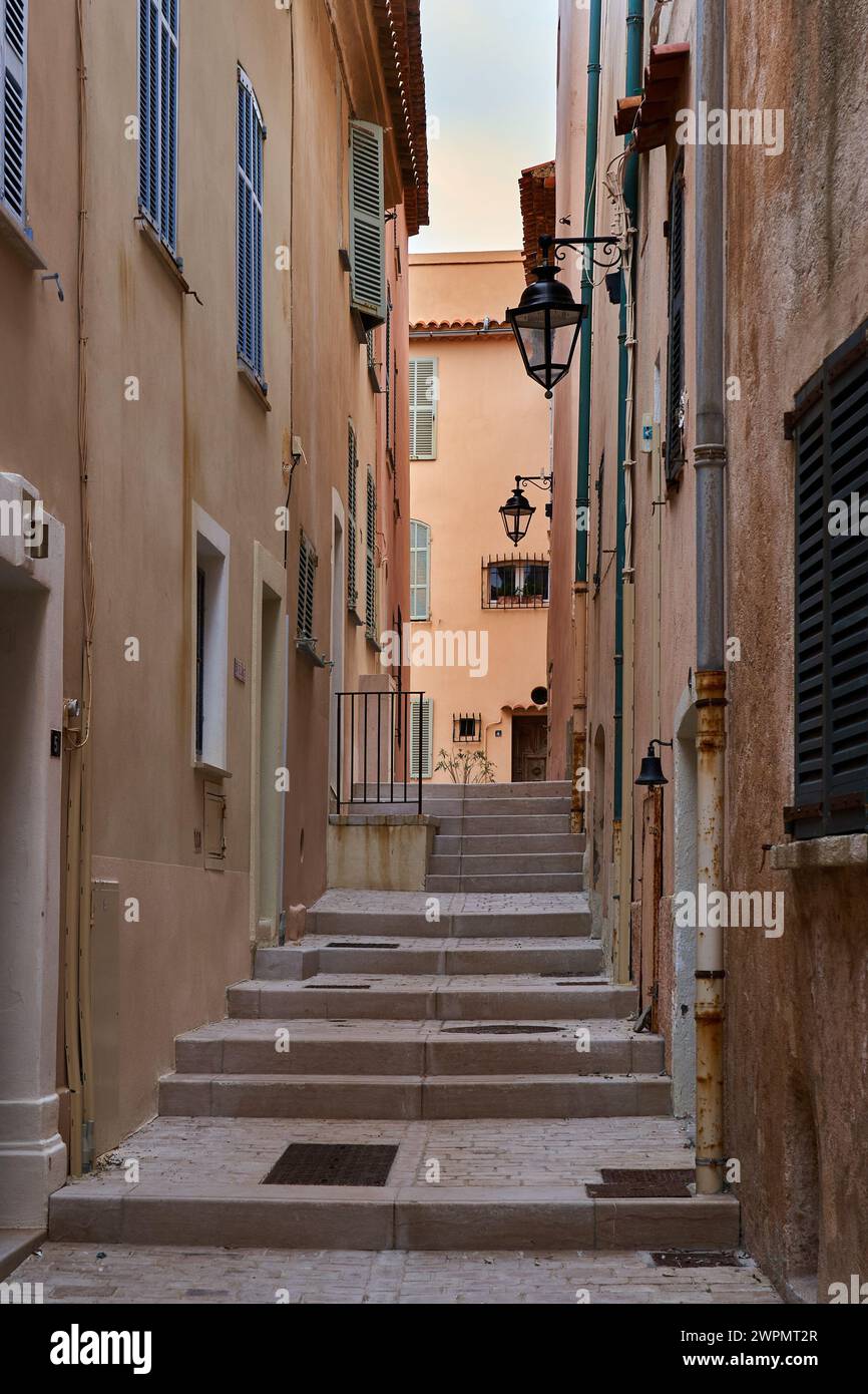 A traditional European street in a small town featuring a series of ...