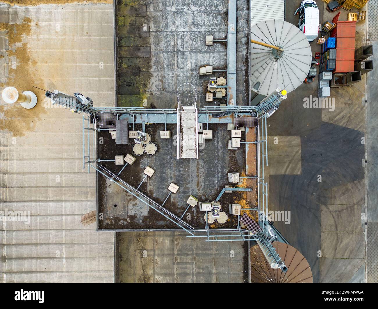 This top-down aerial photograph showcases an industrial setting where ...