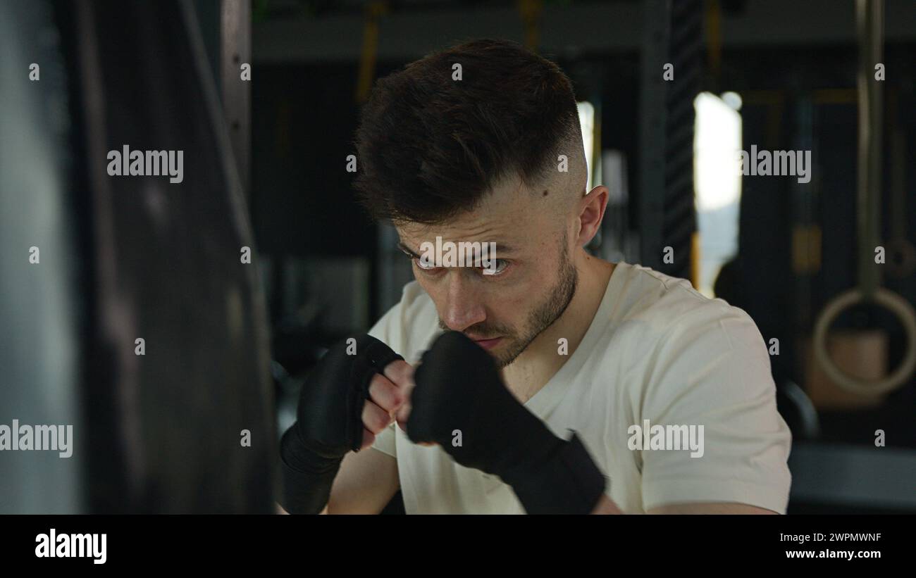 Active motivated sportsman male professional fighter boxer training ...