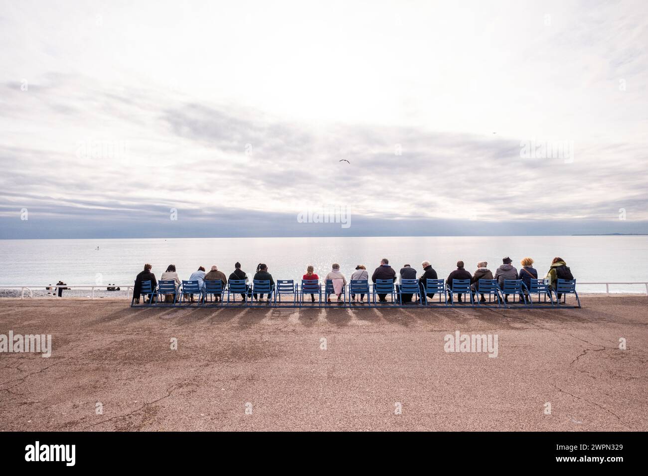 People on the beach promenade of Nice, Nice in winter, South of France ...