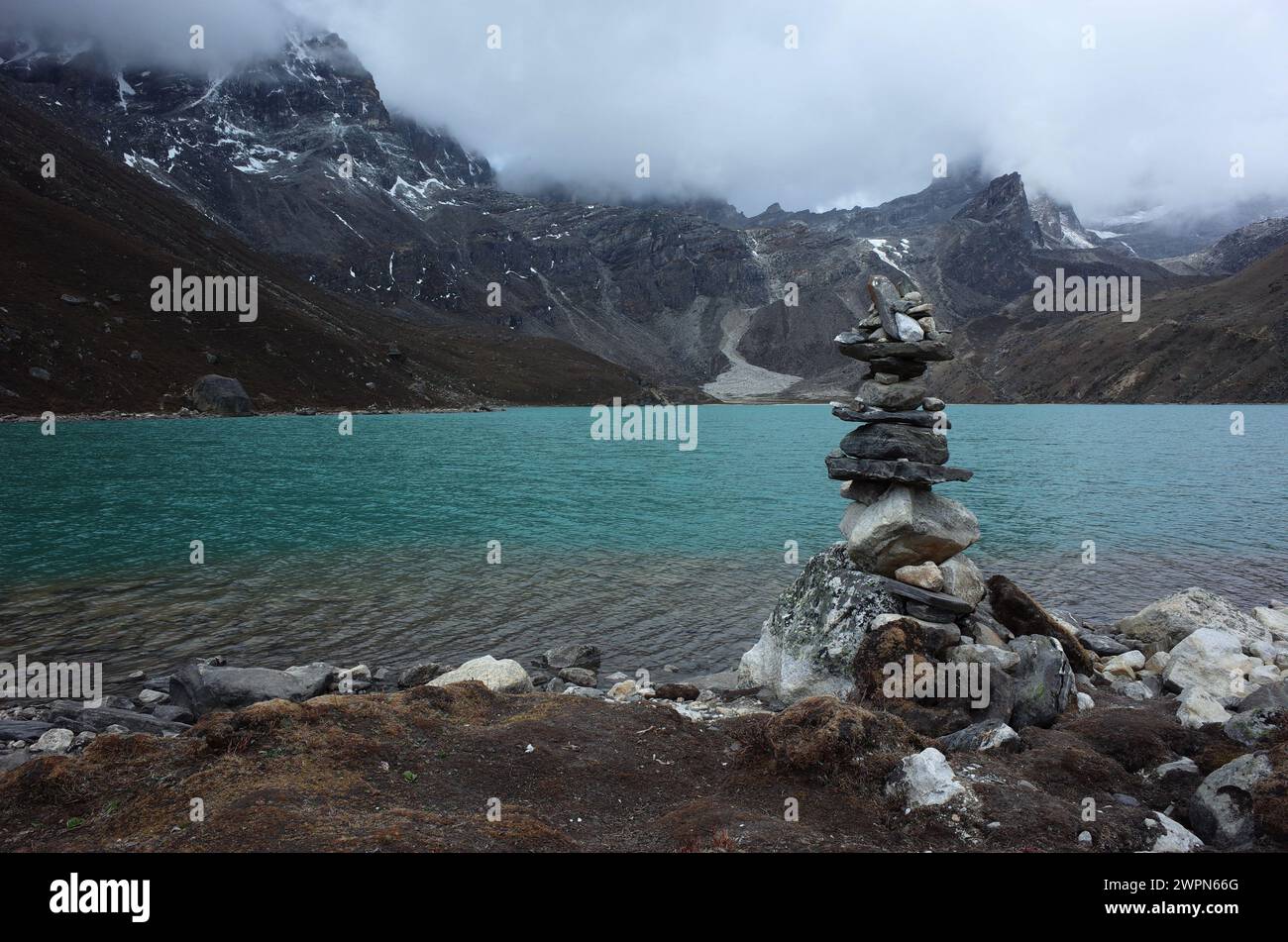Hiking in Nepal Himalayas, Stone pyramid next to Gokyo lake (4870 m) in ...